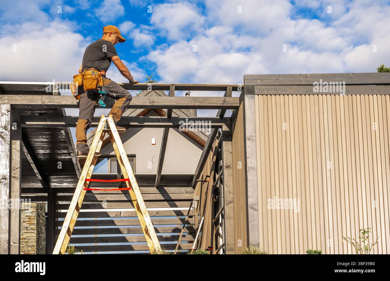 Construction worker carefully balances hi-res stock photography and ...