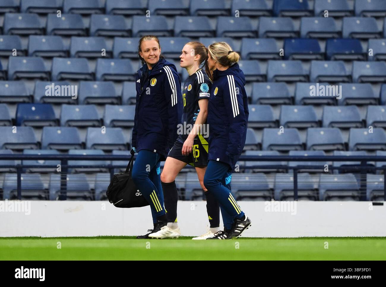 Scotland's Amy Rodgers leaves the pitch after picking up an injury ...