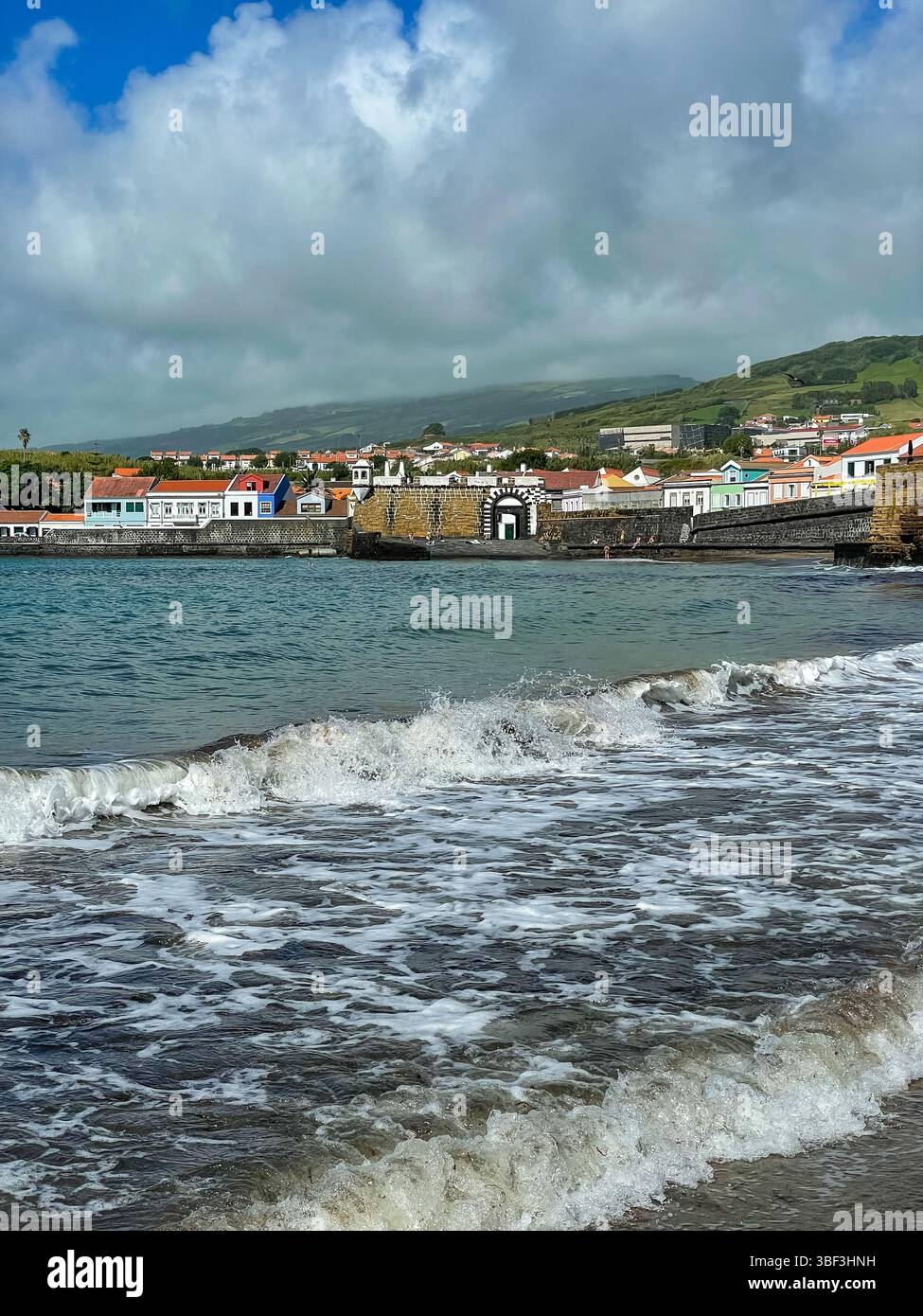 Shoreline of Horta on Faial Island, Azores, with waves reaching the ...