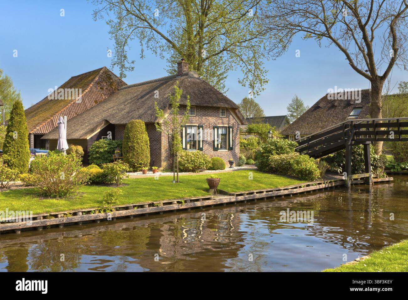 Beautiful traditional house with a thatched roof on a small island in a ...