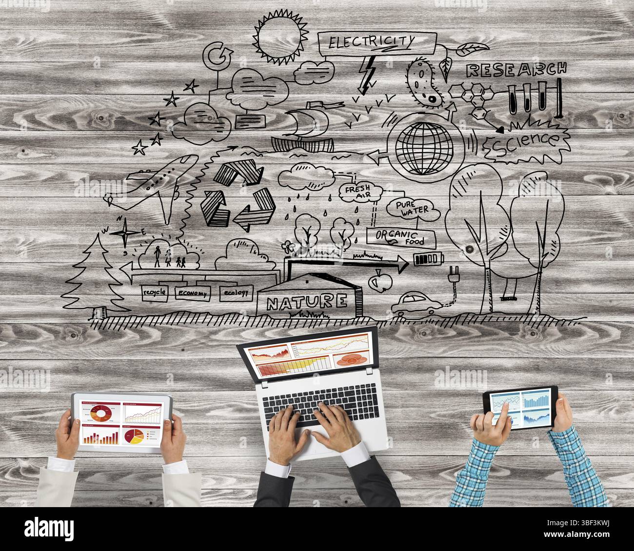 Group of three people with devices in hands working together as symbol ...