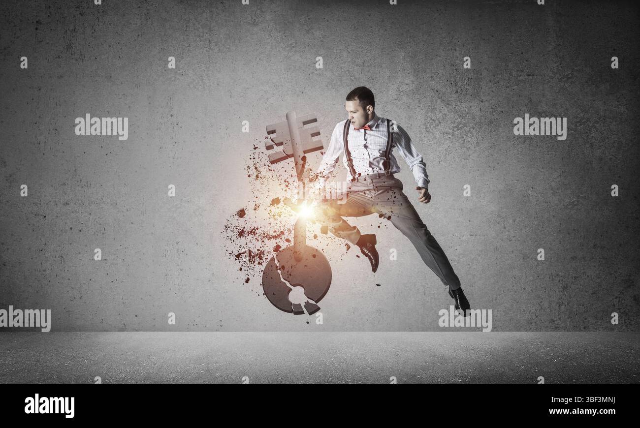 Breaking through access concept with furious man in room crashing ...