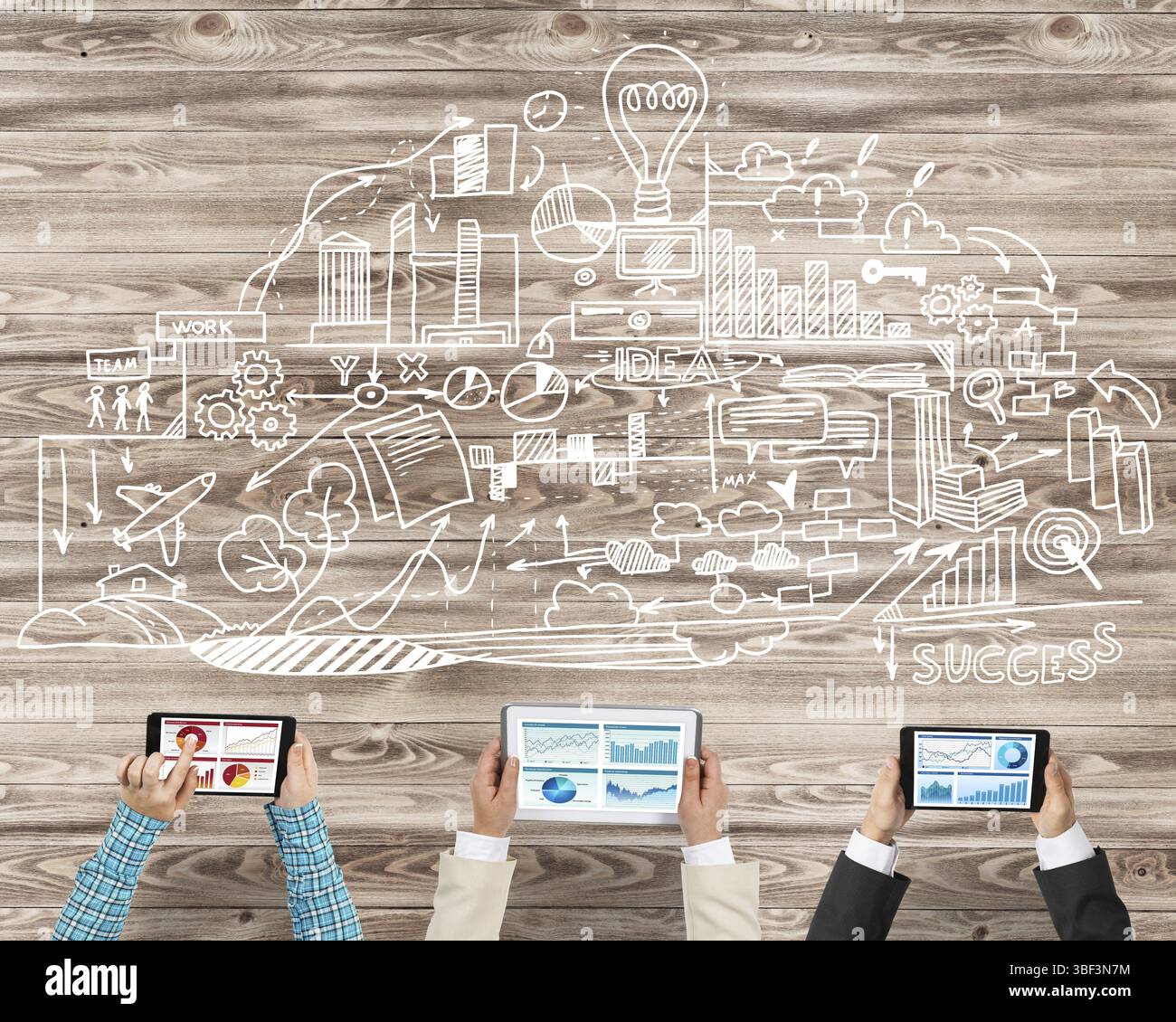 Group of three people with devices in hands working together as symbol ...