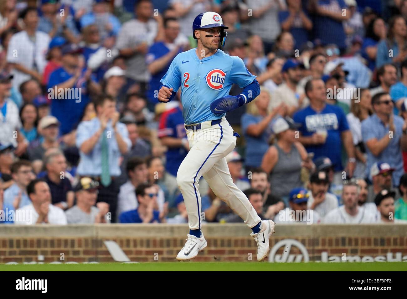 Chicago Cubs' Nico Hoerner (2) runs home to score on a triple by ...