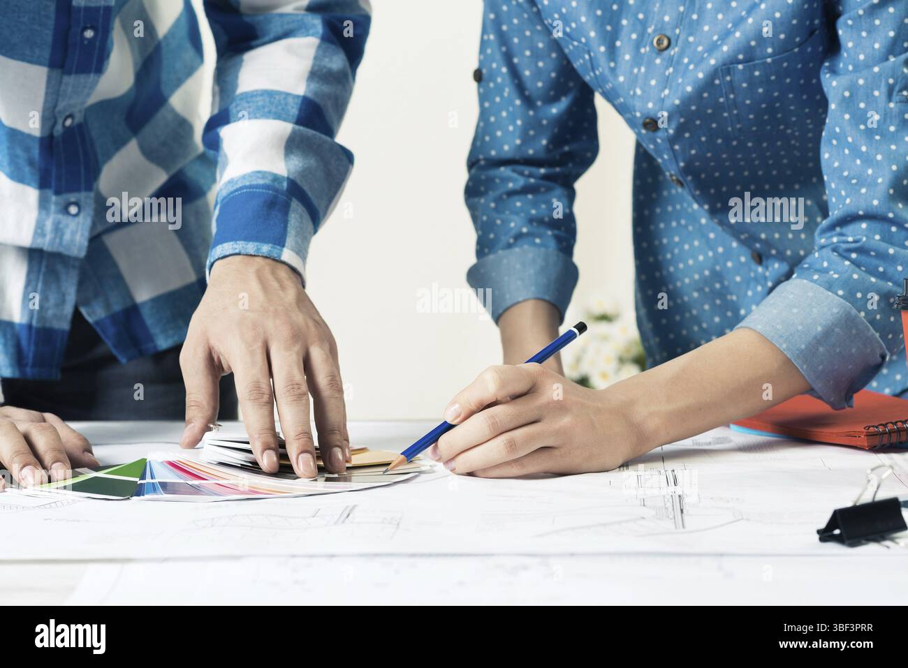 Designers selecting color palette for design project. Human hands ...