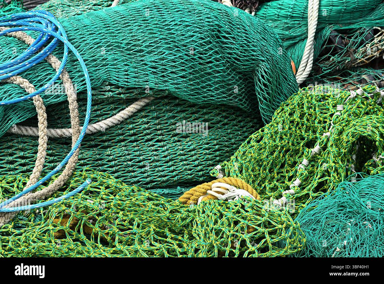 Colorful fishing nets and ropes in a harbor – maritime detail Stock ...