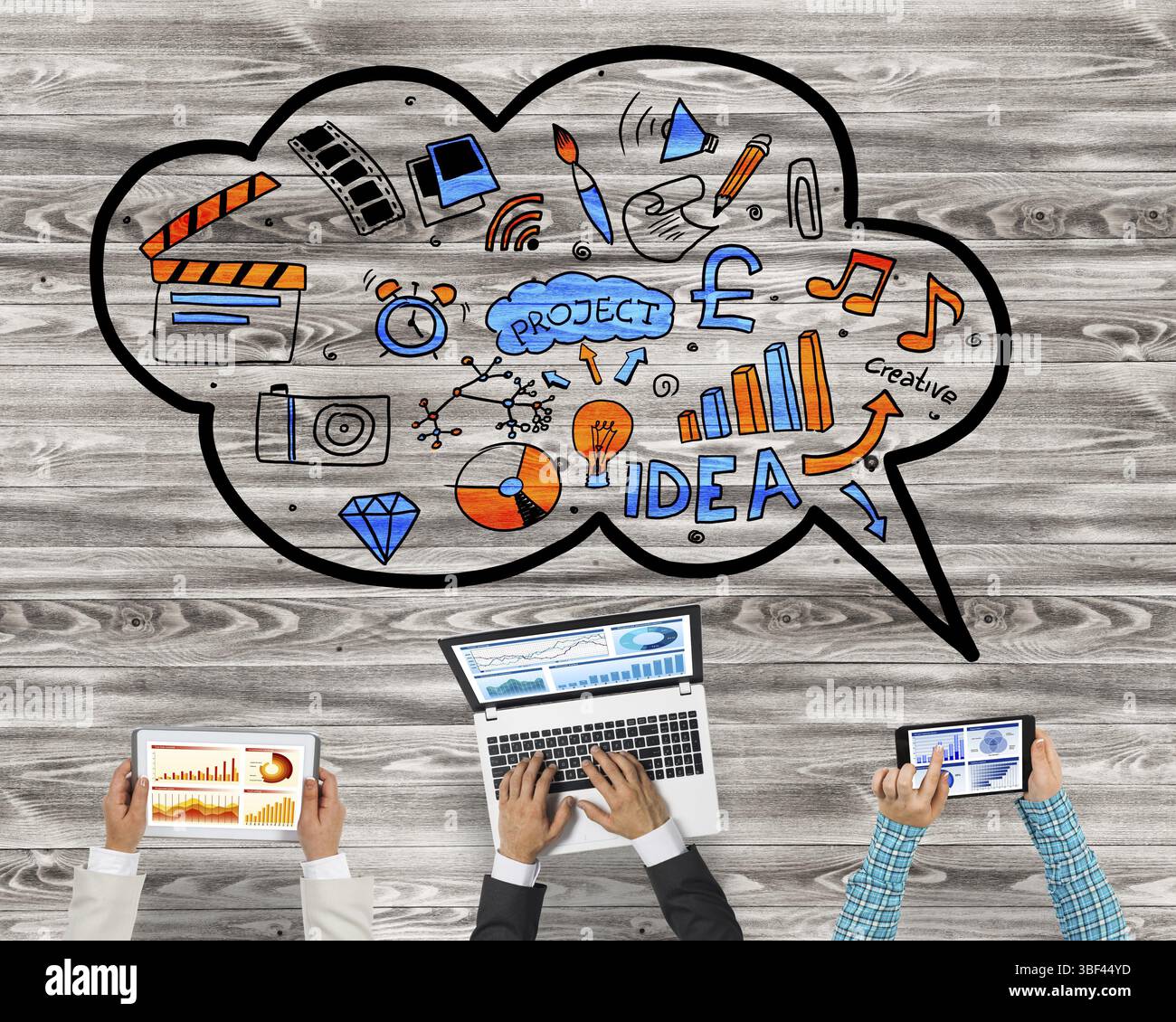 Group of people with devices in hands working together as symbol of ...