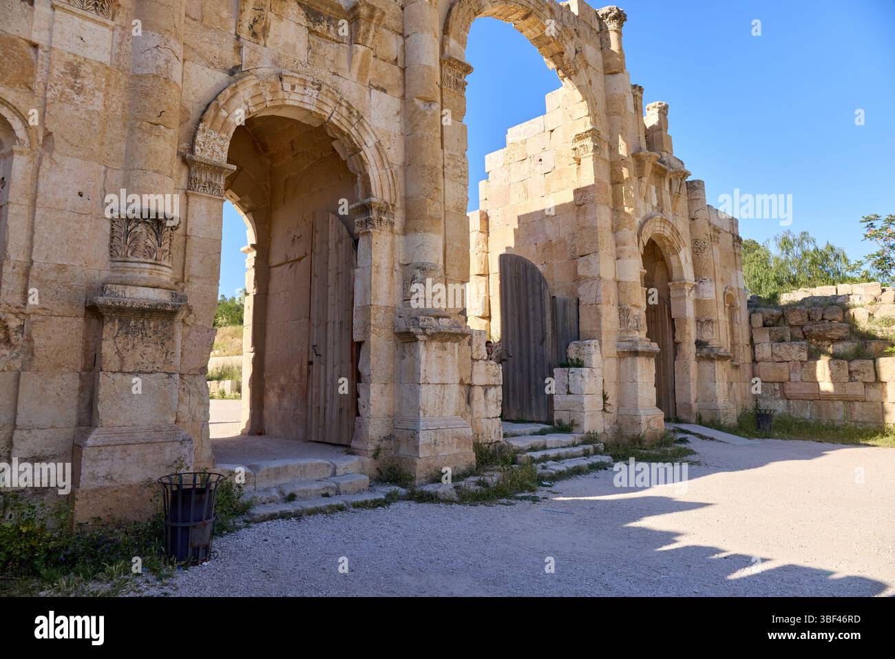 Visitors walk through the monumental ancient arches of Jerash, a site ...
