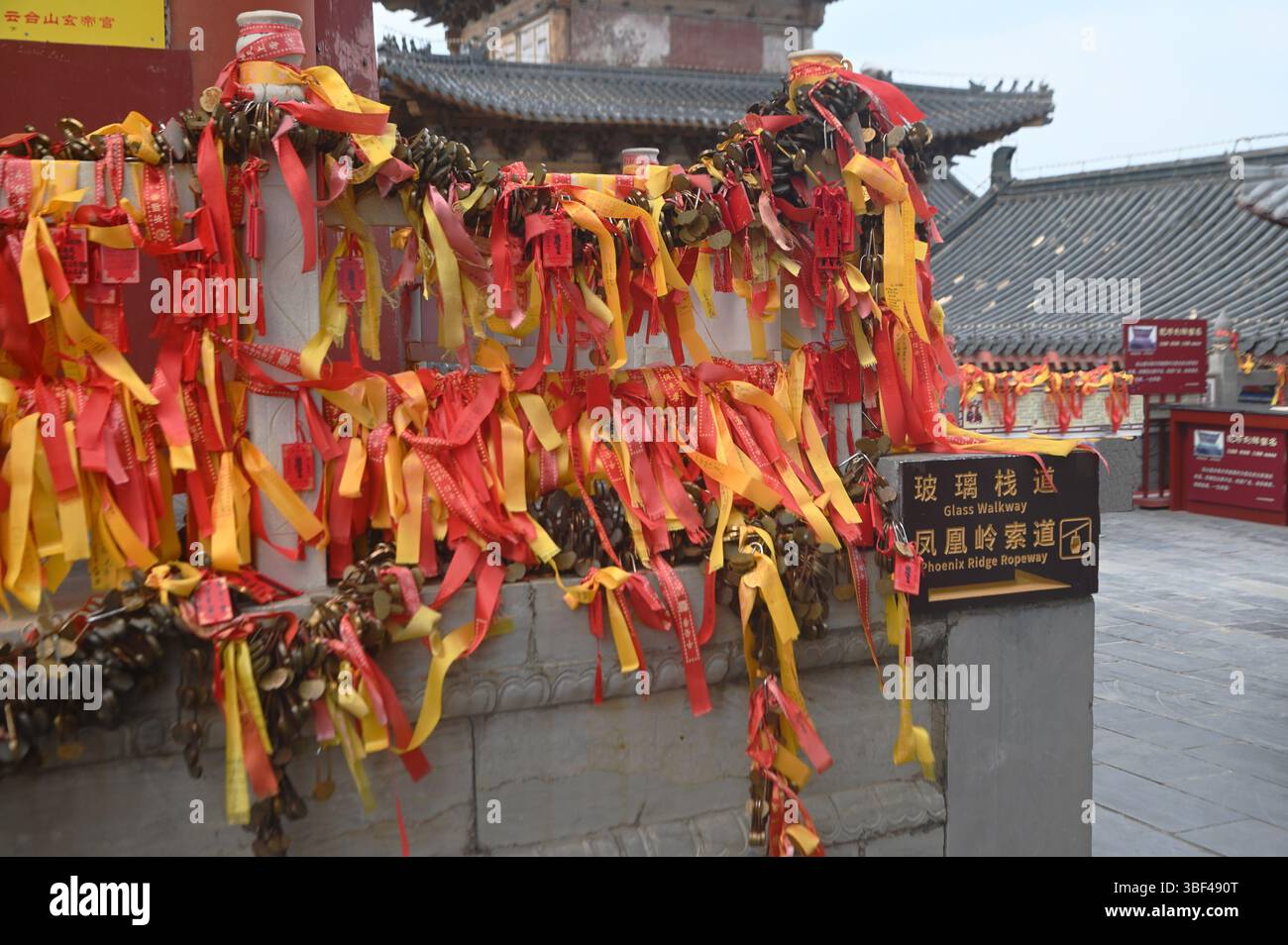 Red ribbons or cloth talismans tied to pillars in Taoist temples at ...