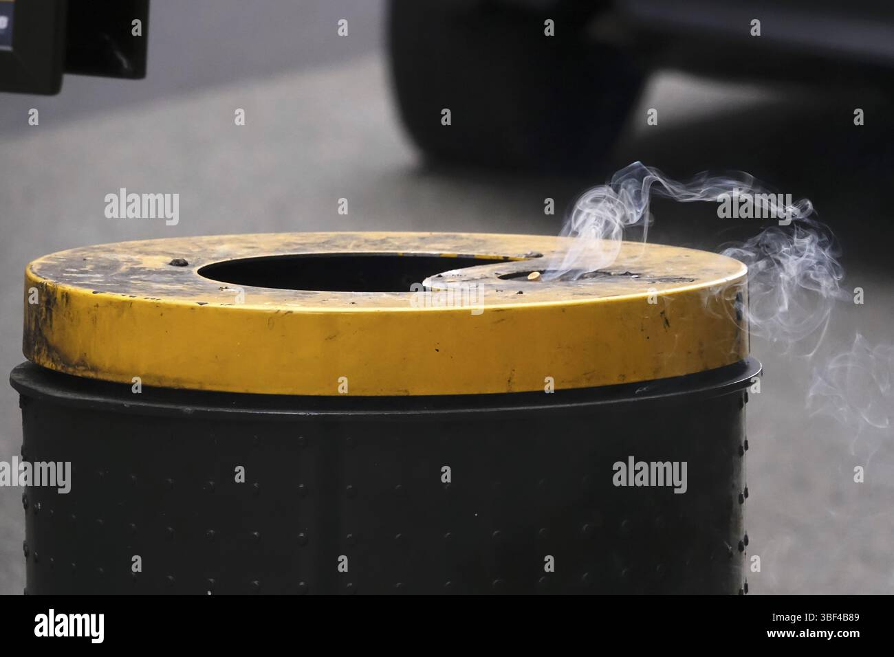 Cigarette smoke, rubbish bin in a city, Germany, Europe Stock Photo - Alamy