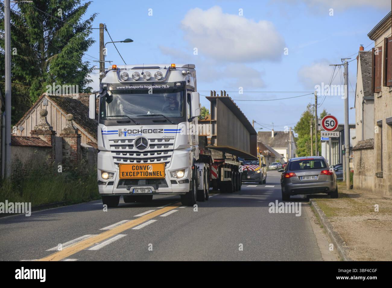 Heavy transport with excess width, lorry loaded with steel girder with ...