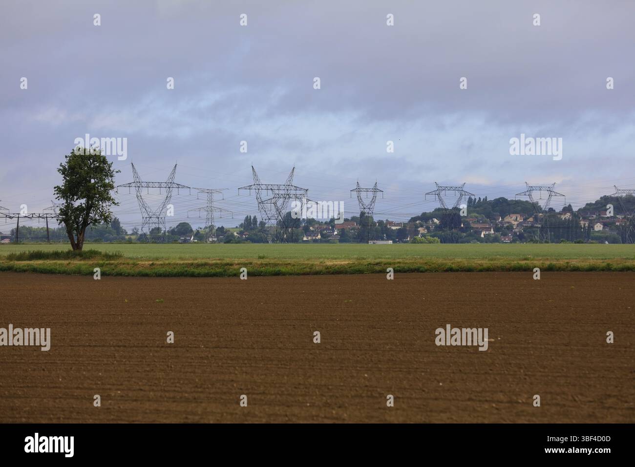 High-voltage power lines in the open field at the Poste electrique de ...