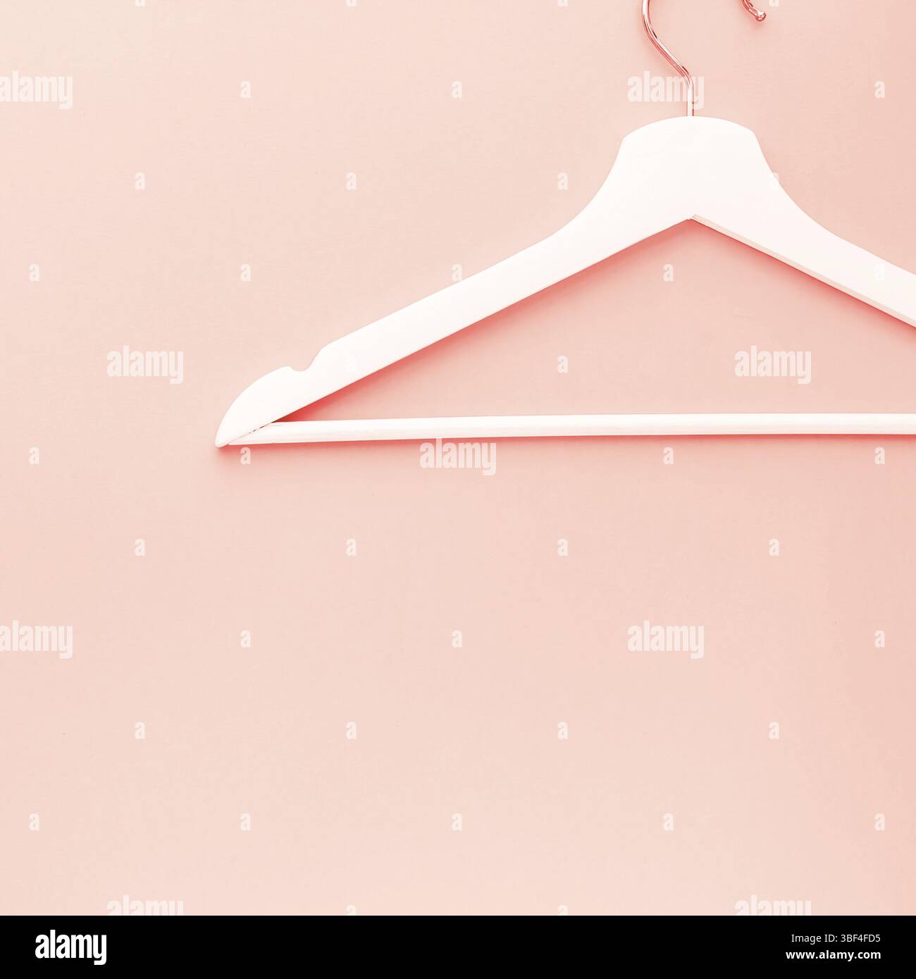Creative top view flat lay wooden hangers toned living coral color of ...