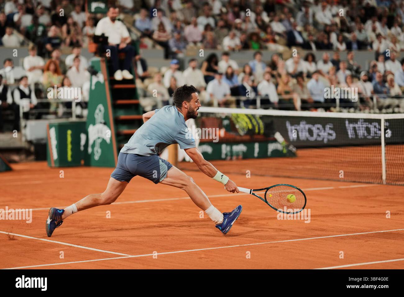 Bosnia and Herzegovina's Damir Dzumhur returns the ball to Spain's ...