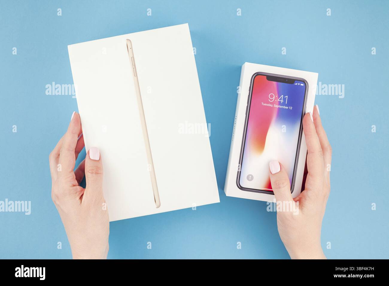 BERLIN, GERMANY - MAY 24, 2018: Woman hands holding boxes of the latest ...