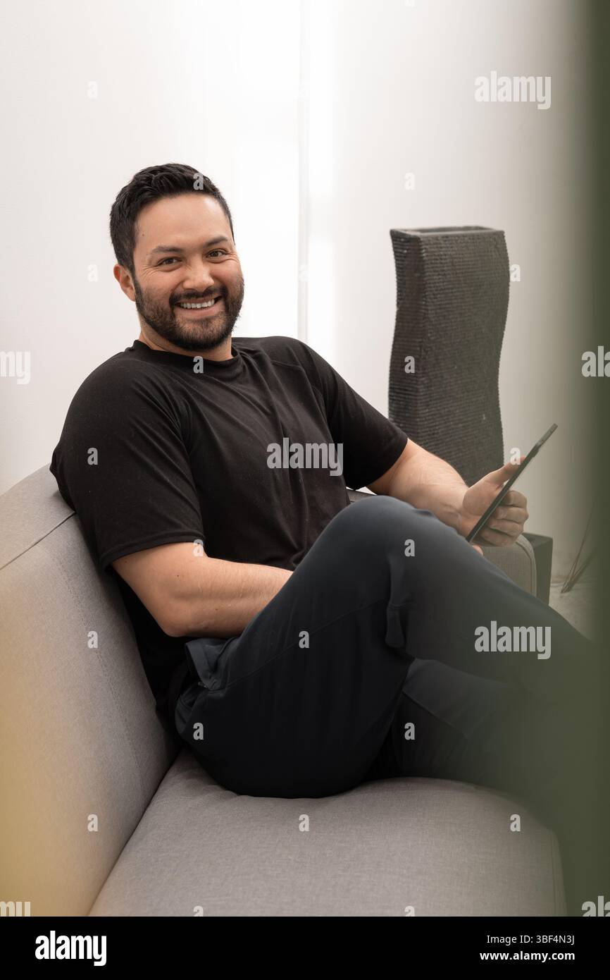 Pharma rep reads product info on tablet in modern office, preparing for ...