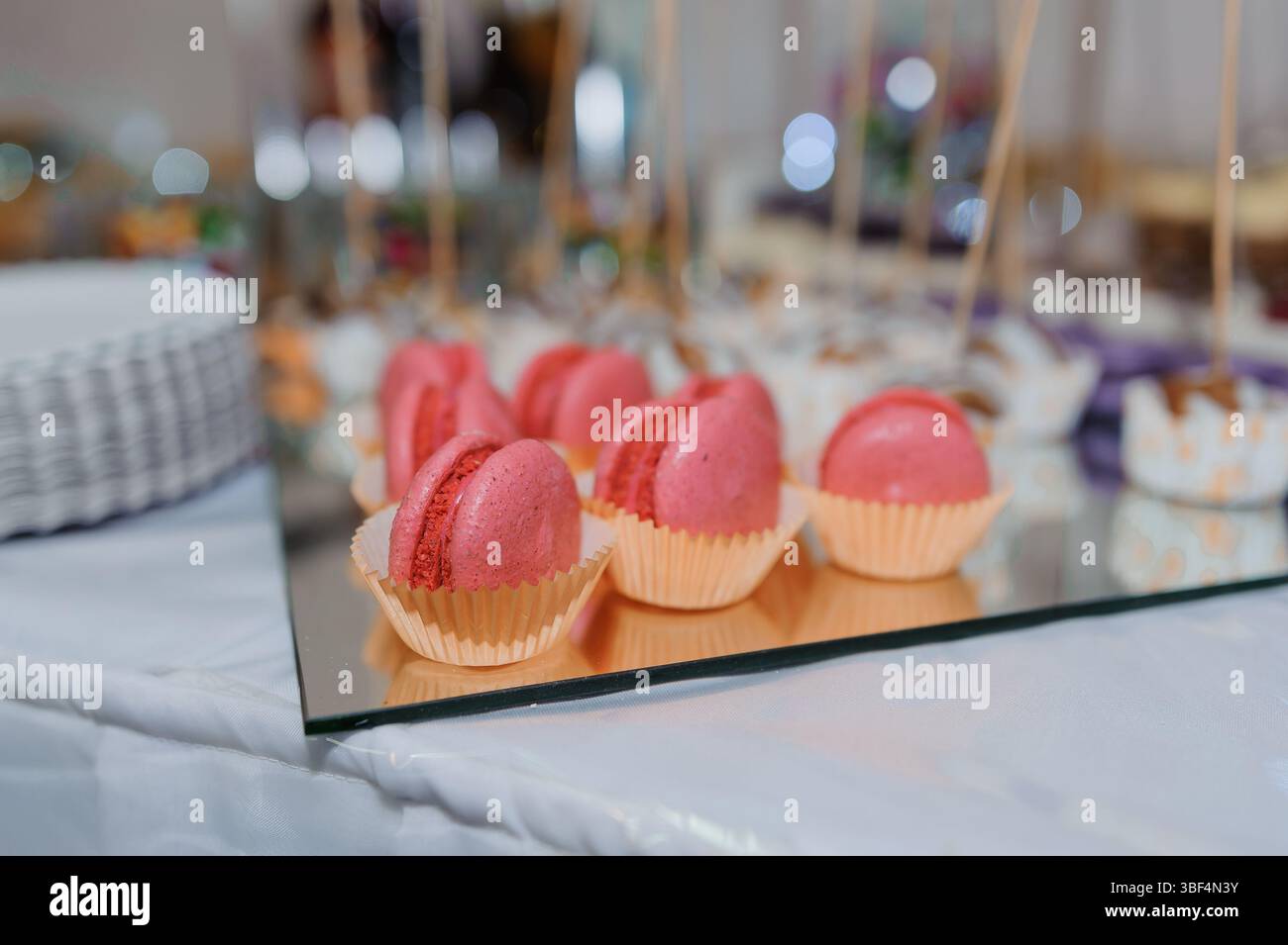 A close-up shot showcases a beautifully arranged dessert table ...
