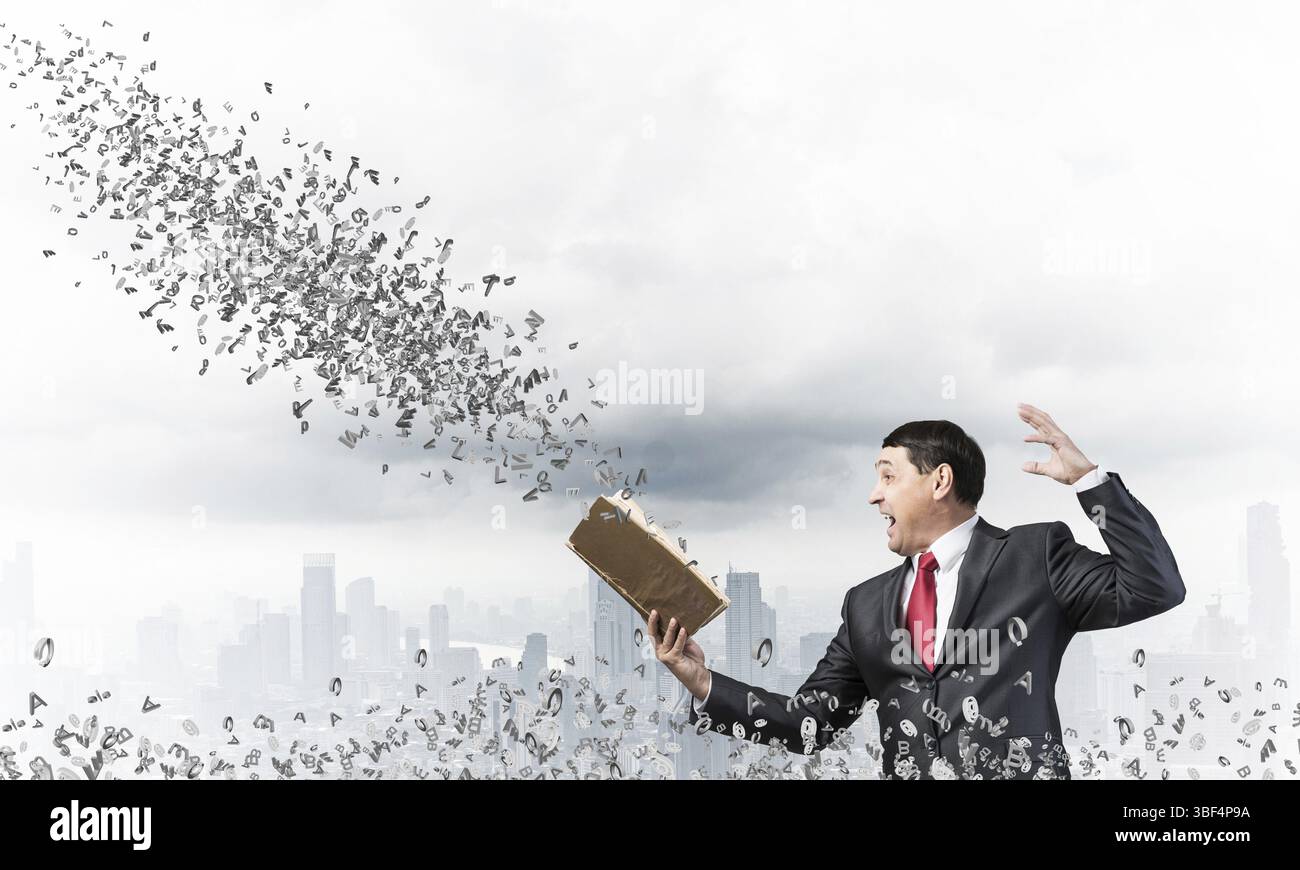 Expressive businessman holding open book. Emotional man in suit ...