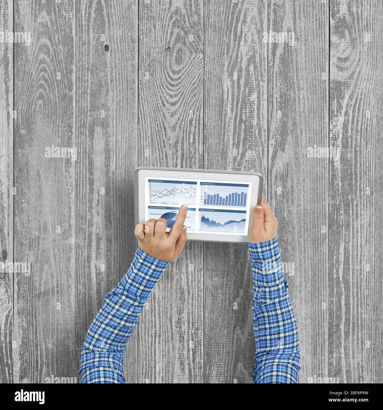 Top view of girl hands using tablet pc with diagrams and graphs on ...