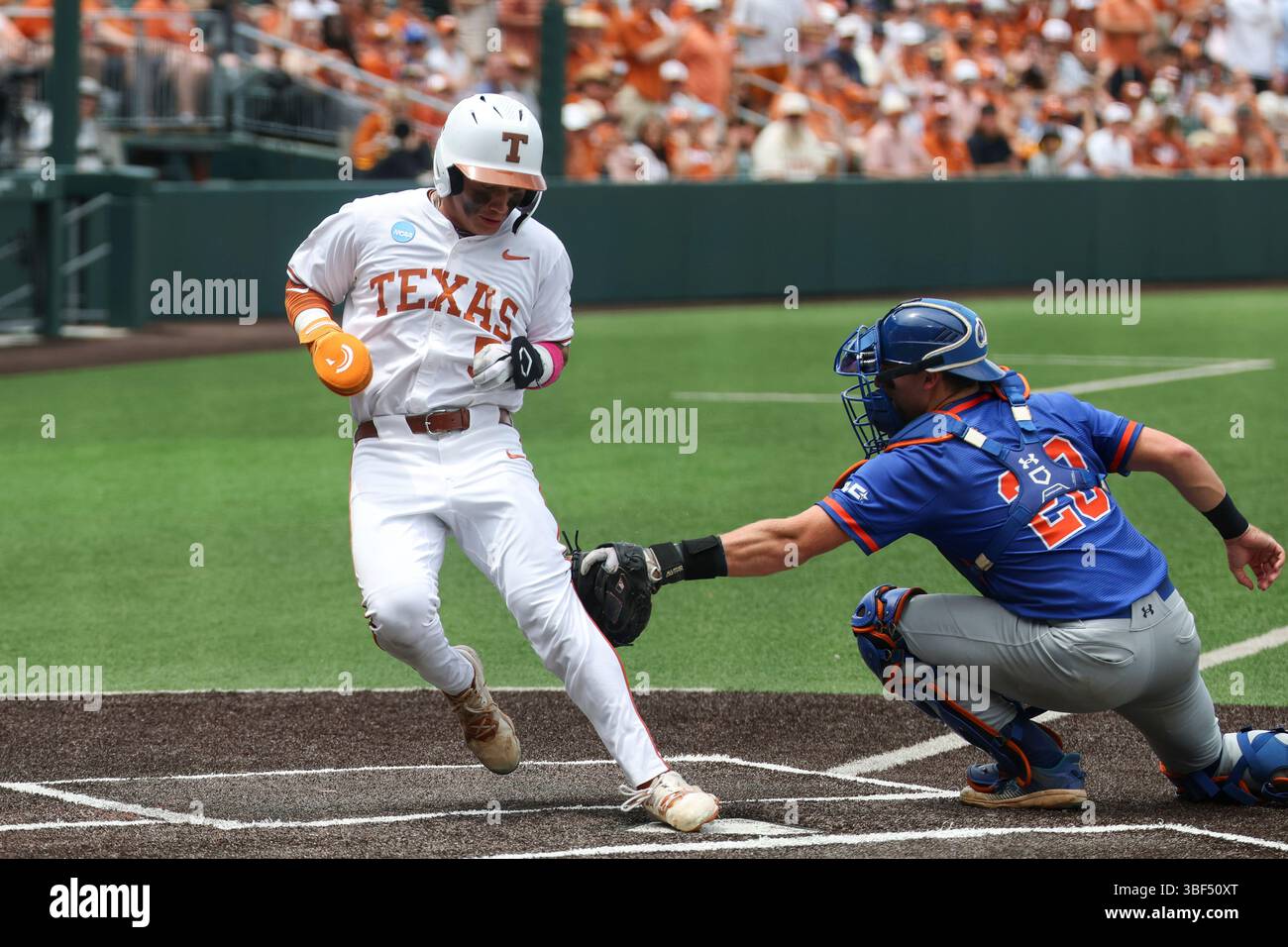 AUSTIN, TX - MAY 30: Texas infielder Ethan Mendoza (5) just touches ...