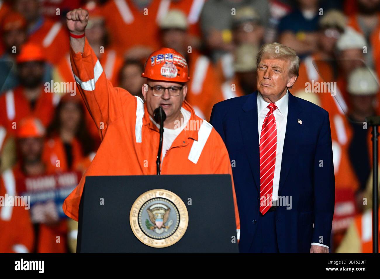 President Donald Trump listens as steelworker Brian Pavlack speaks at the U.S. Steel Mon Valley ...