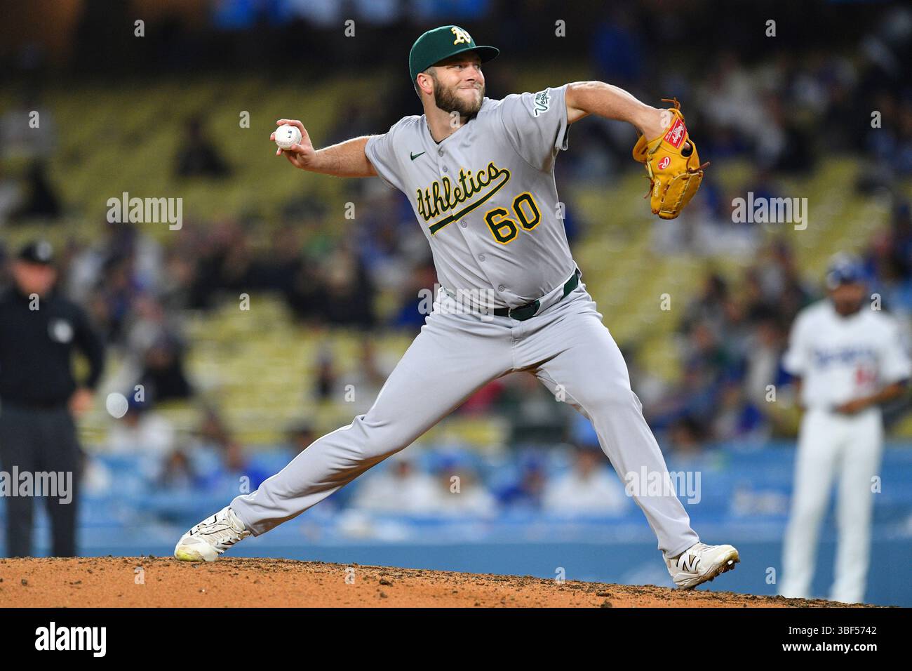 LOS ANGELES, CA - MAY 13: Athletics pitcher Justin Sterner (60) throws ...