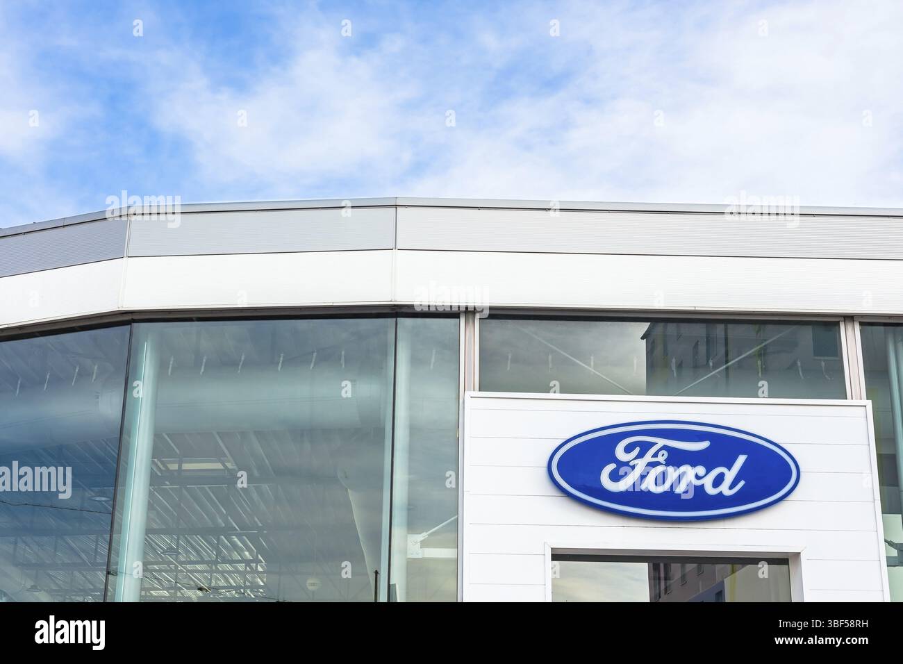 Ford Motor Company brand logo on bright blue sky background located on ...