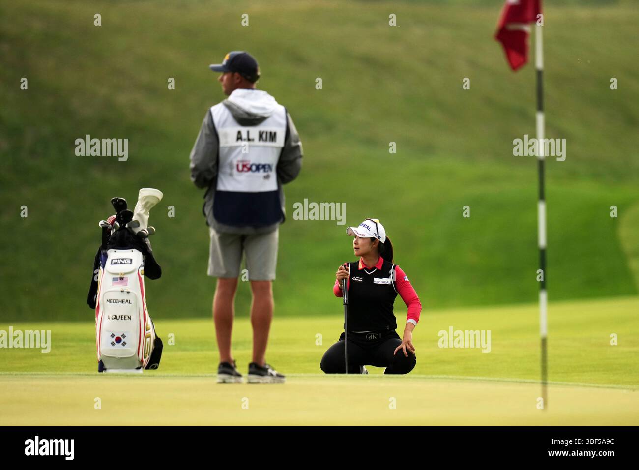A Lim Kim, of South Korea, reacts on the 17th green as the horn sounds ...