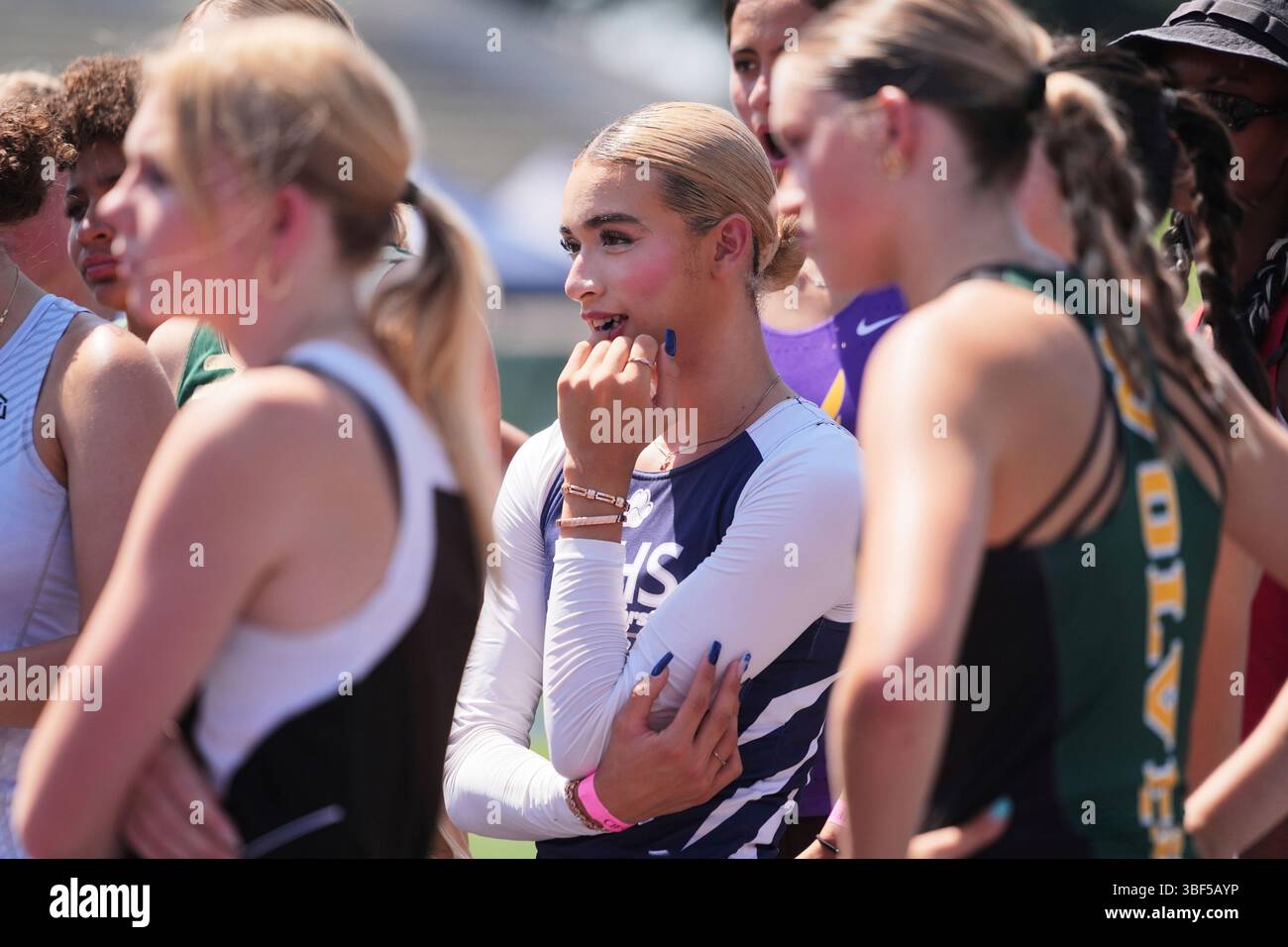 AB Hernandez, center, joins other athletes for a briefing before the ...