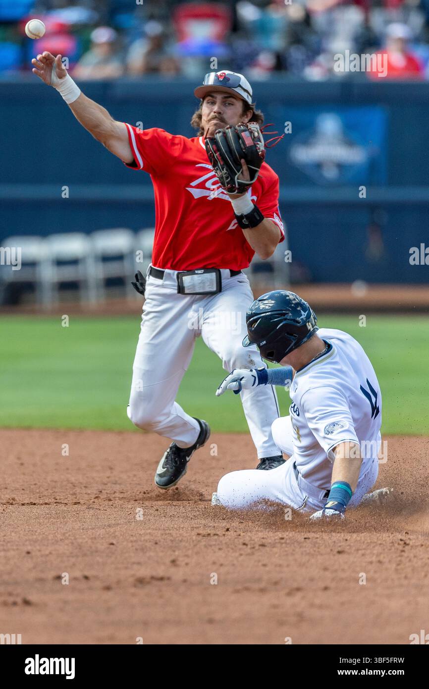 Western Kentucky infielder Austin Haller (2) turns a double play over ...