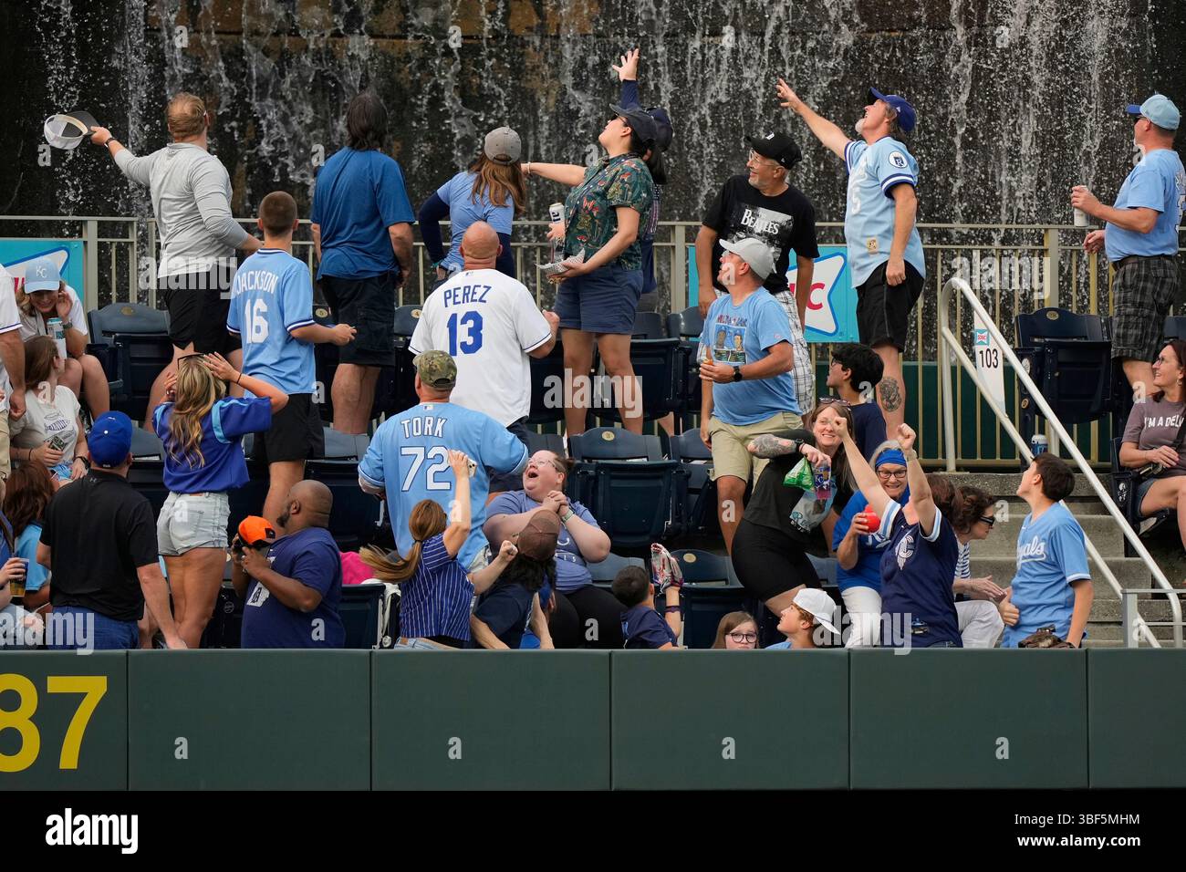 Fans watch a solo home run ball hit by Kansas City Royals' Bobby Witt ...