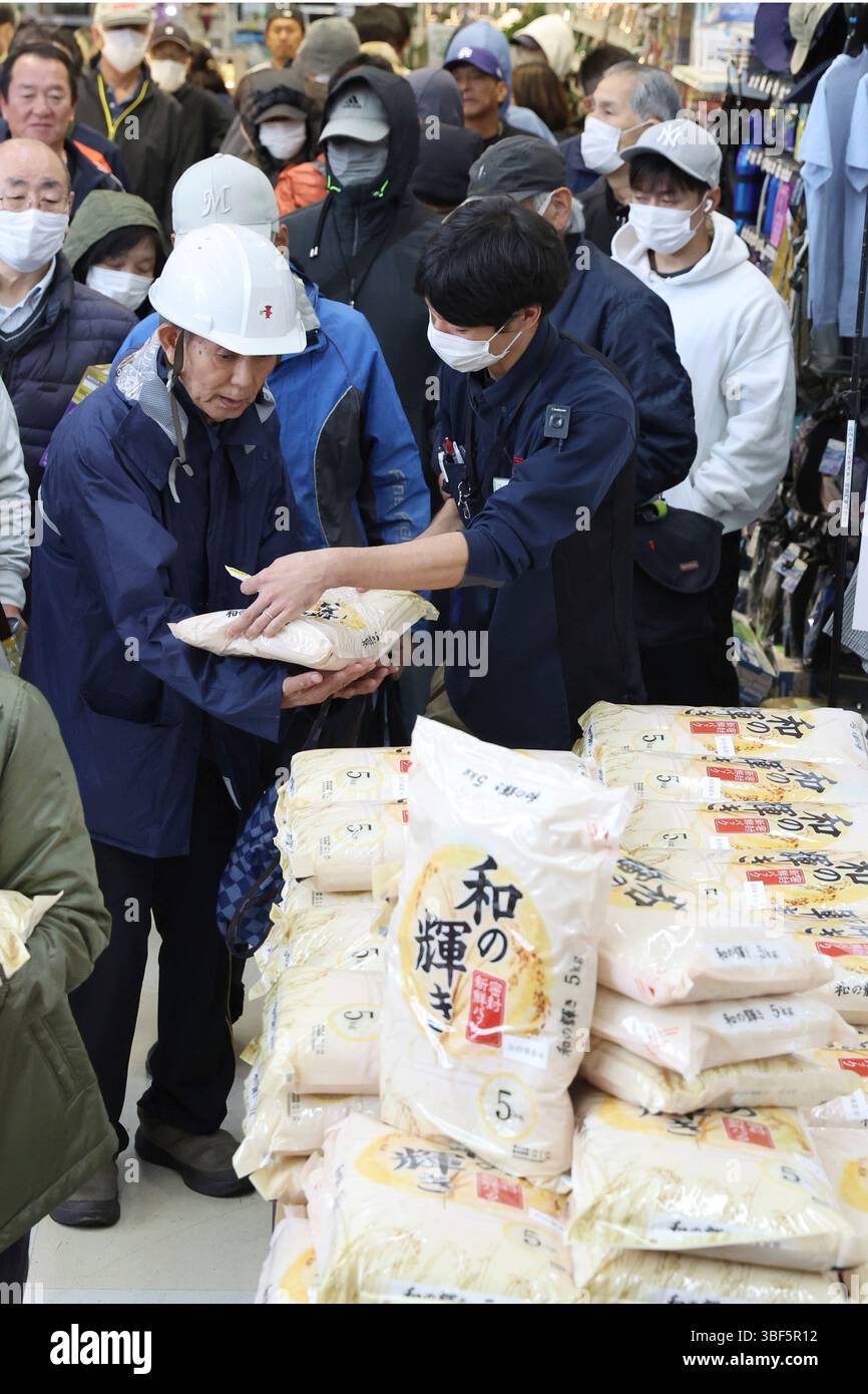 Packages of stockpiled rice are started to sell at a store in Matsudo ...