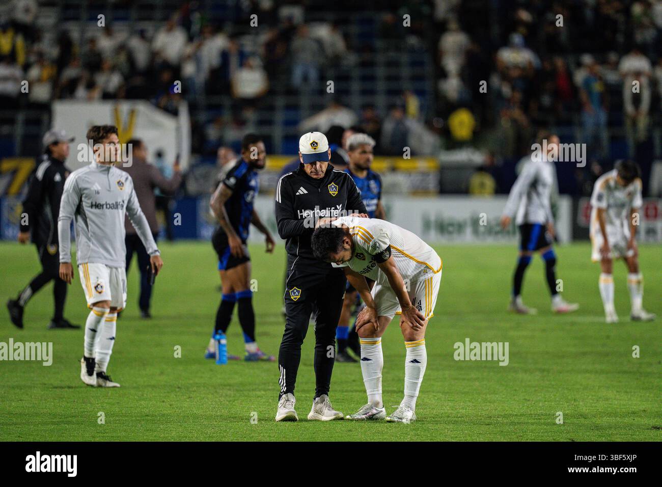 LA Galaxy defender Maya Yoshida (4) is consoled by the coaching staff ...