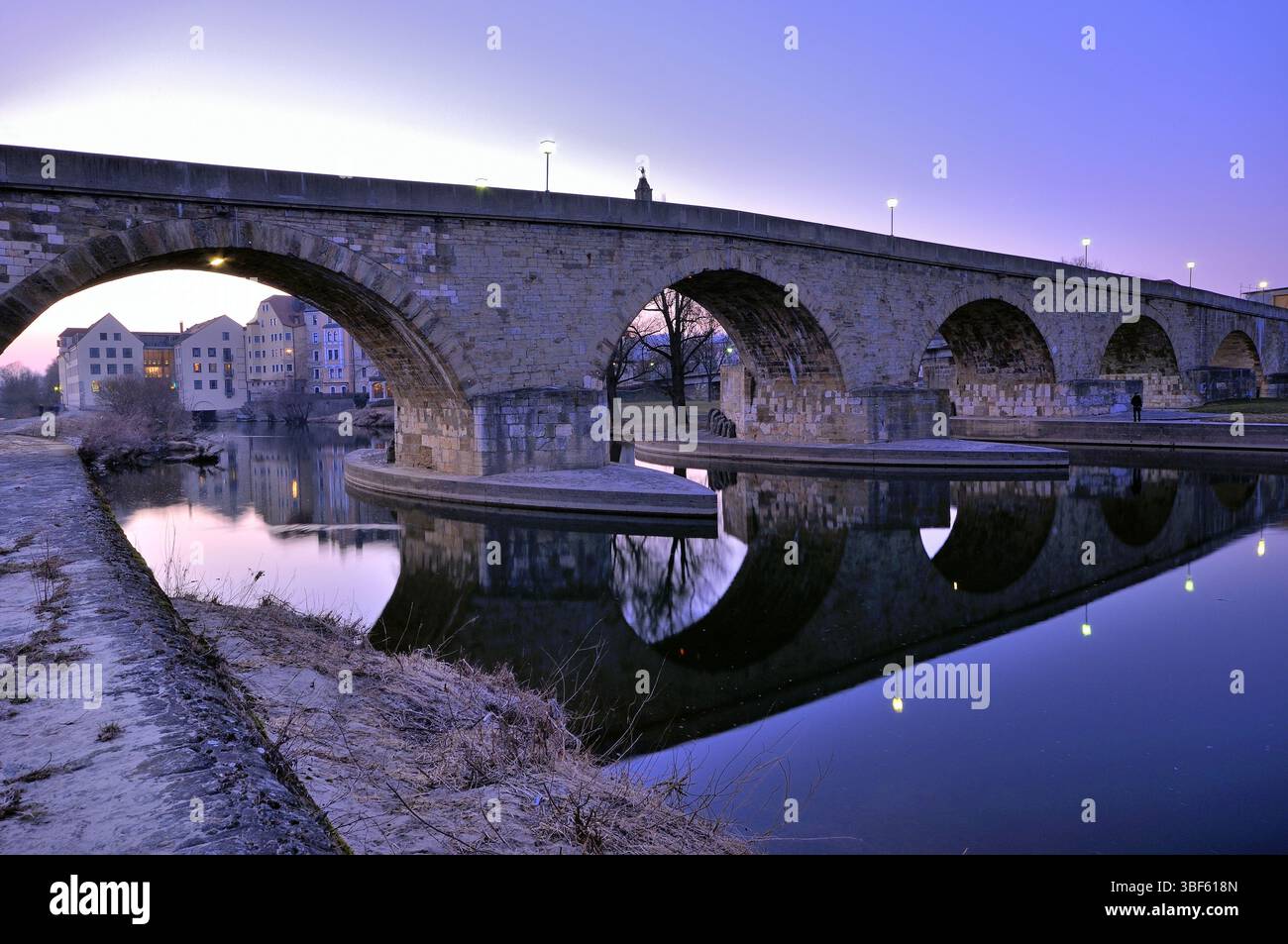 The Roman Stone Bridge spanning the Danube River in Regensburg, Germany ...