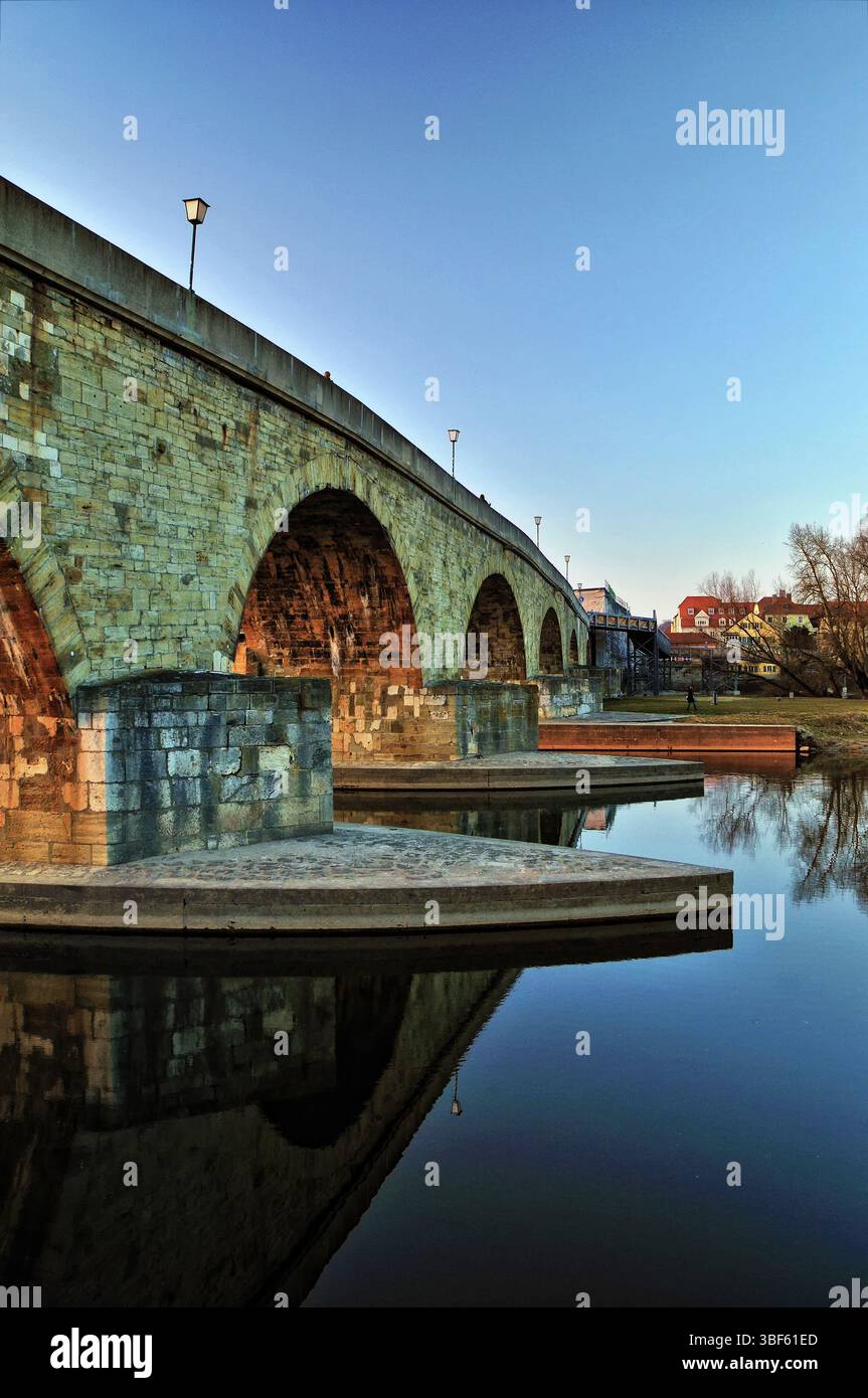 The Roman Stone Bridge spanning the Danube River in Regensburg, Germany ...