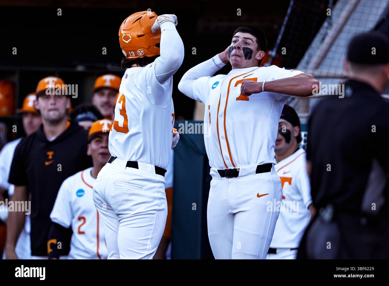 Tennessee outfielder Reese Chapman (13) is congratulated by Gavin Kilen ...
