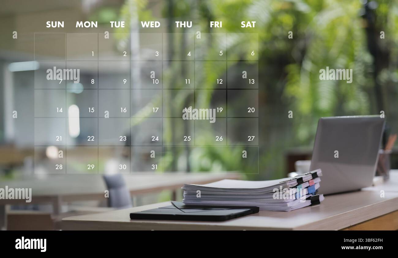 A 2025 calendar desk with laptop, stack of papers, and calendar overlay ...
