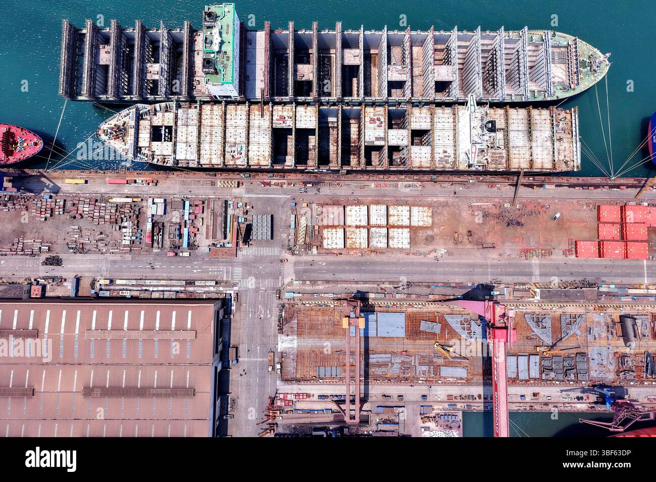 Aerial view of commercial ships under construction at a shipyard in ...
