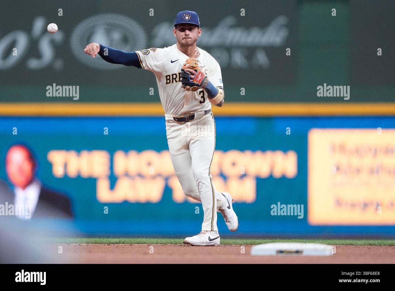 Milwaukee Brewers' Joey Ortiz throws to first base during a baseball ...