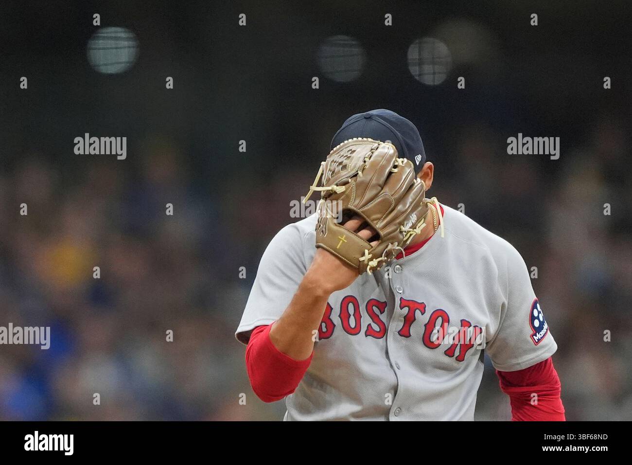 Boston Red Sox's Brennan Bernardino pauses before pitching during a ...