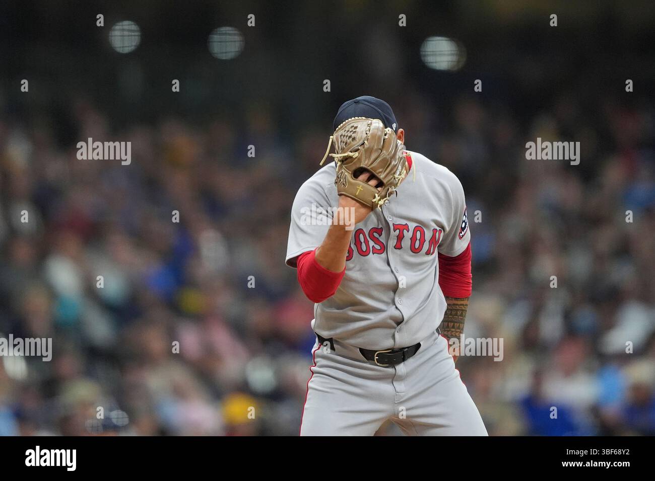 Boston Red Sox's Brennan Bernardino pauses before pitching during a ...