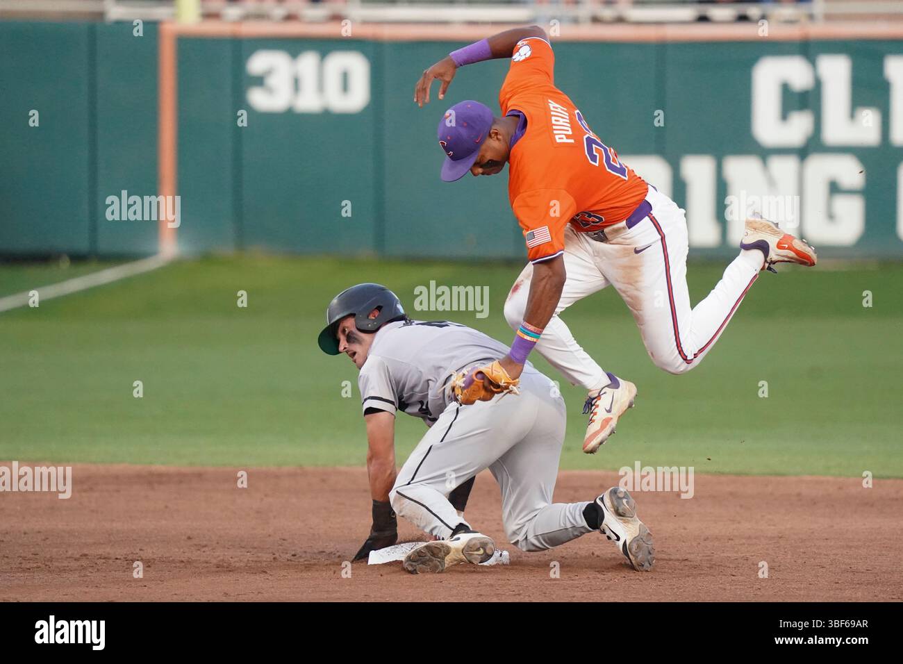 Clemson infielder Jarren Purify (23) attempts to tag out USC Upstate ...