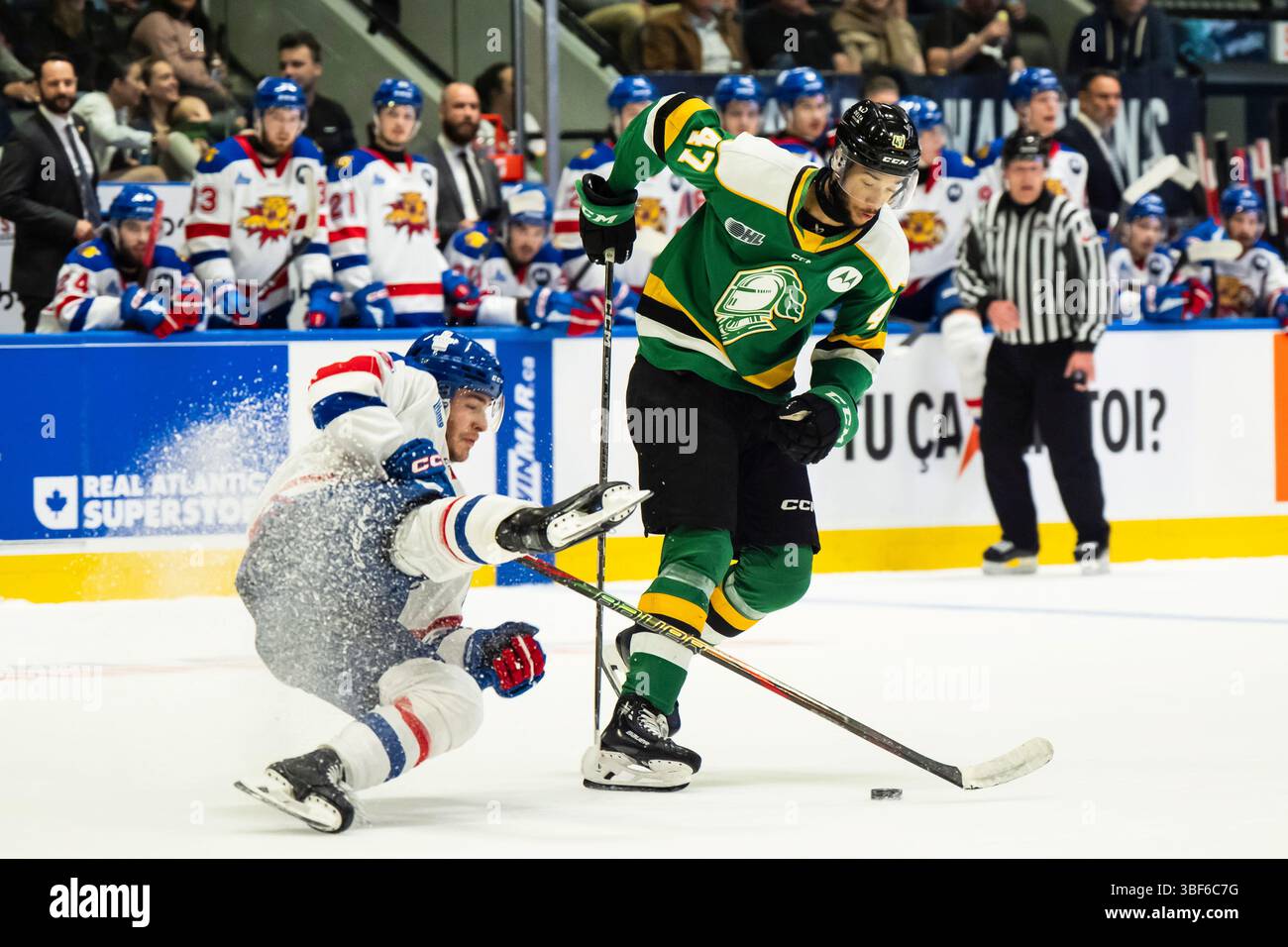 Moncton Wildcats' Etienne Morin (5) falls after defending against London Knights' Blake ...