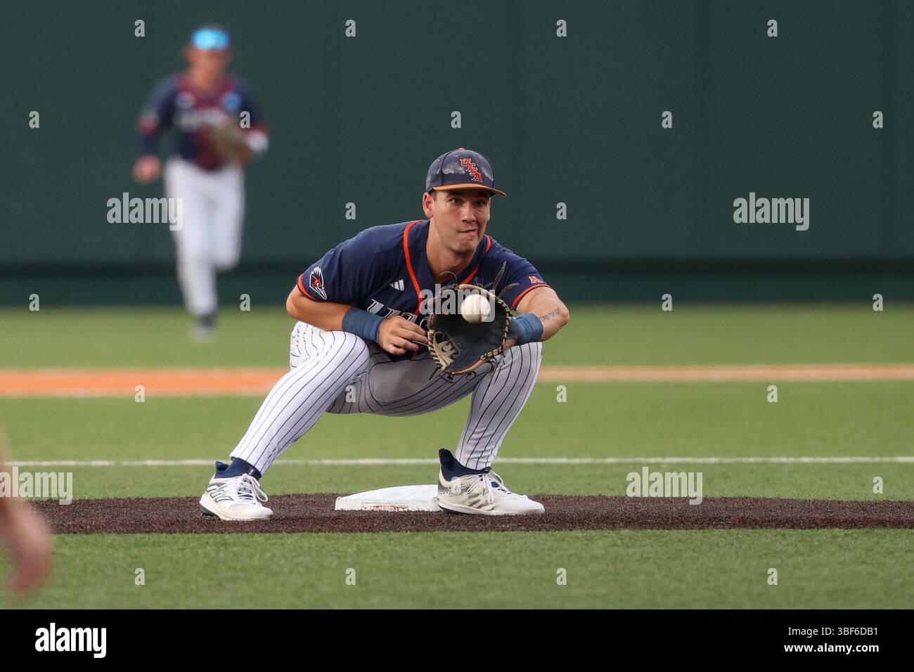 AUSTIN, TX - MAY 30: UTSA infielder Ty Hodge (9) crouches down to catch ...