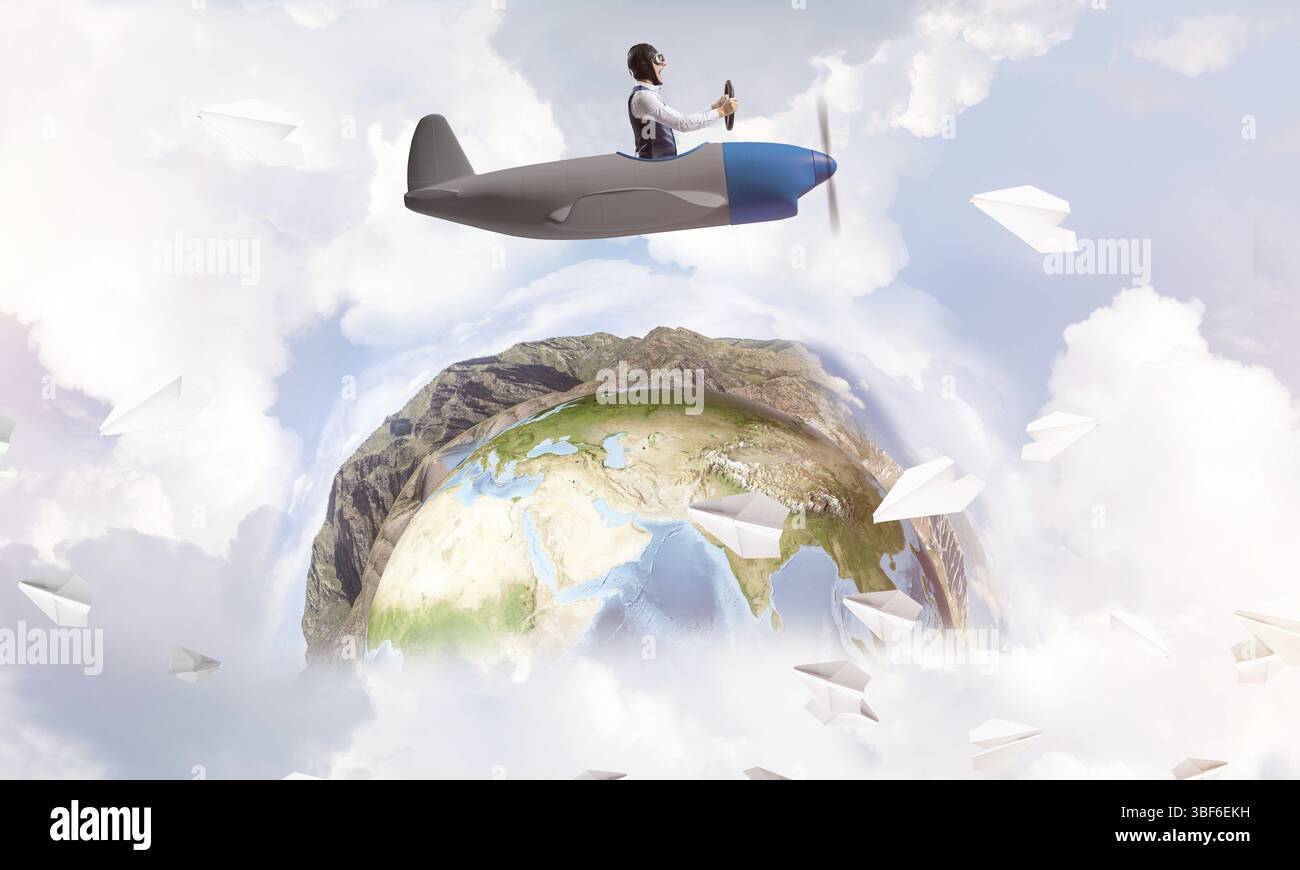 Pilot in leather helmet driving propeller plane on background of blue ...