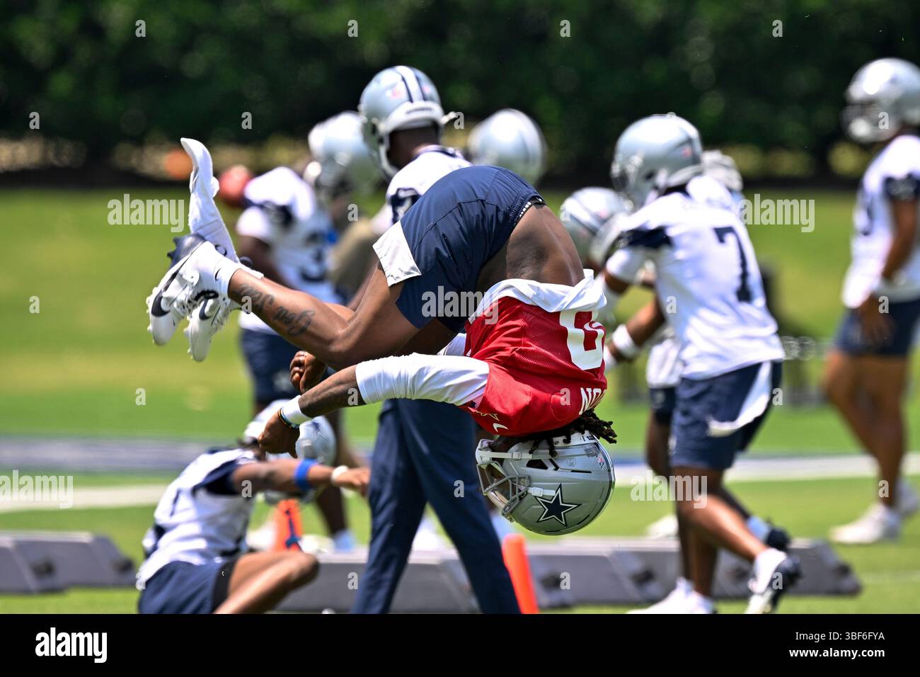 Dallas Cowboys quarterback Joe Milton III does a back flip during NFL ...