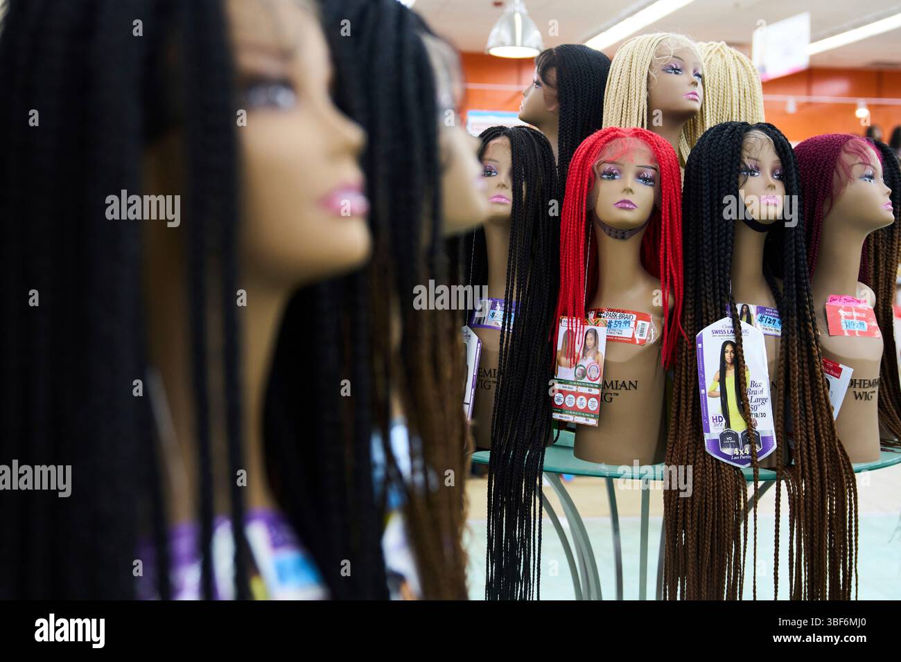 Braided wigs are seen on display at Chapel Beauty, a beauty supply store in Decatur, Ga., Monday ...