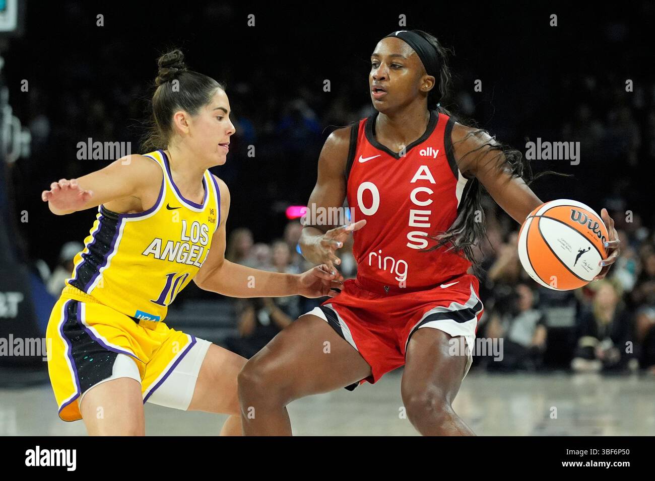 Las Vegas Aces guard Jackie Young (0) drives against Los Angeles Sparks ...