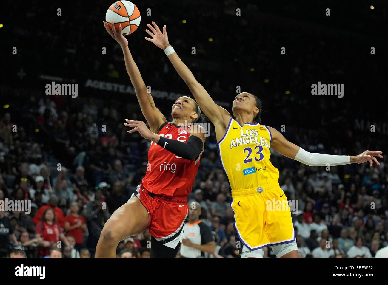 Las Vegas Aces center A'ja Wilson (22) shoots around Los Angeles Sparks ...