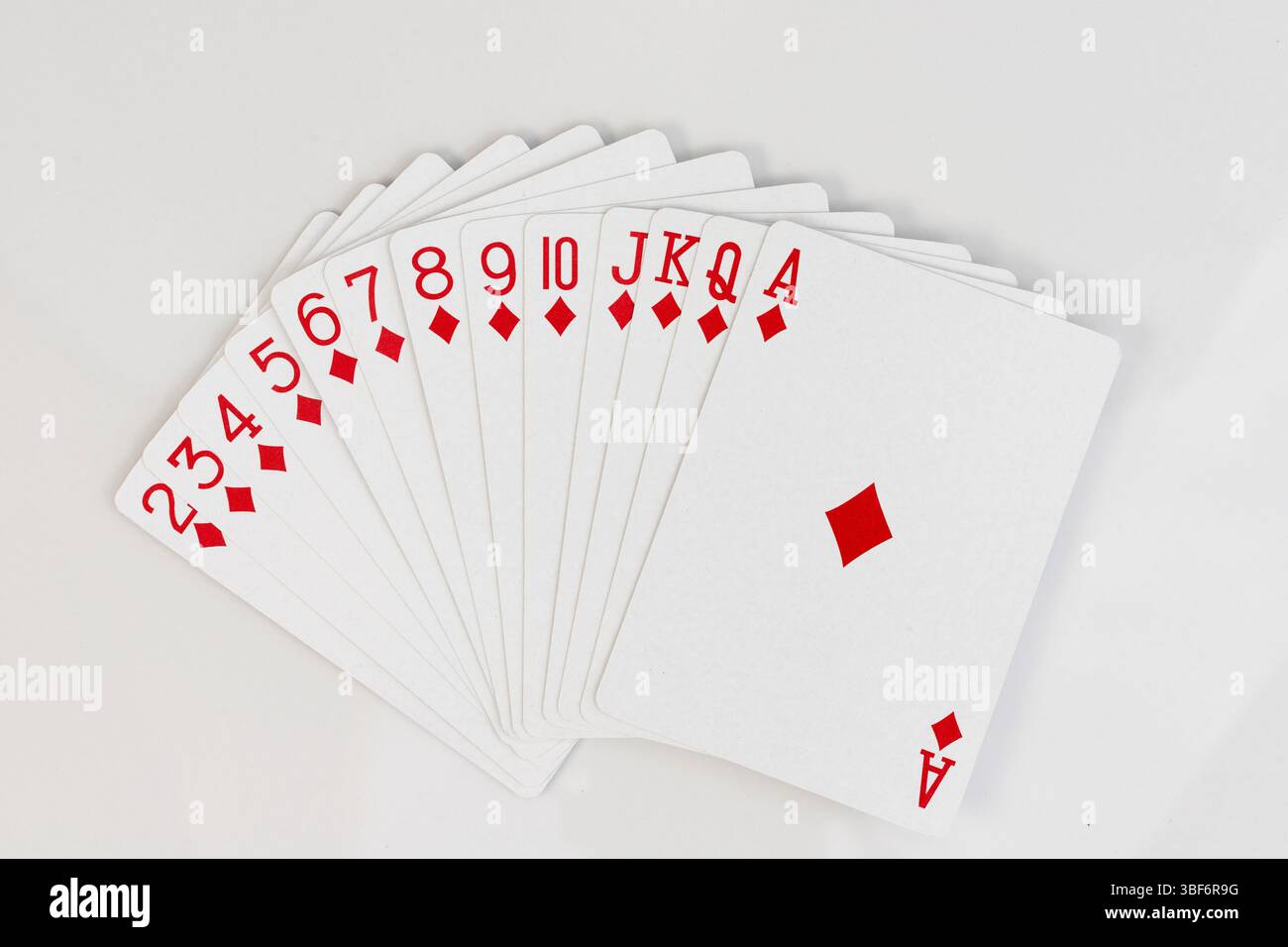 Full set of diamonds playing cards in a sequence on white isolated ...